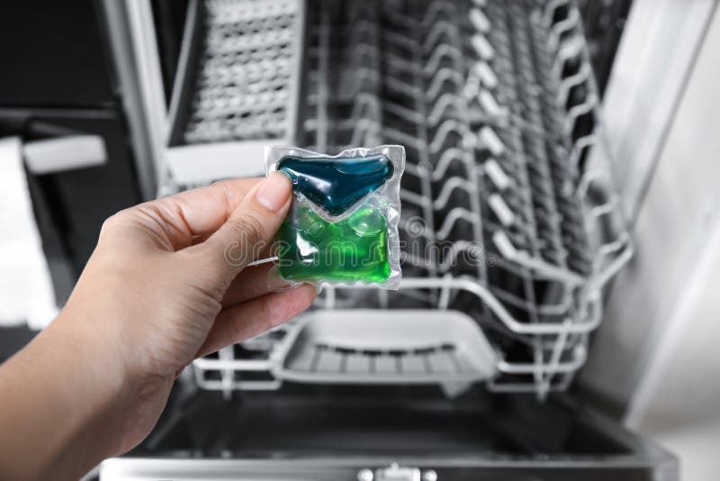 Woman Putting Detergent Pod into Open Clean Modern Empty Automatic ...