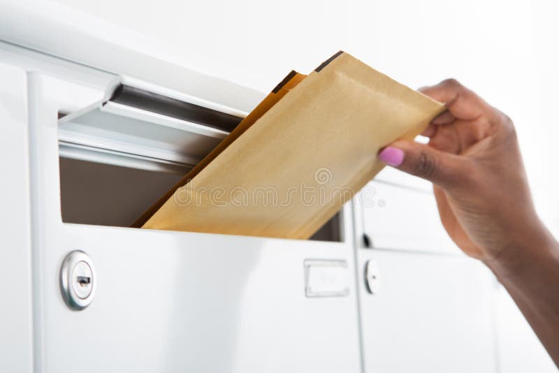 Postman Putting Letters In Mailbox Stock Photo - Image of postal ...