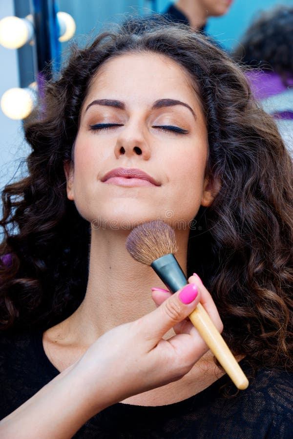 Woman putting make up stock image. Image of hairstyle - 32785585