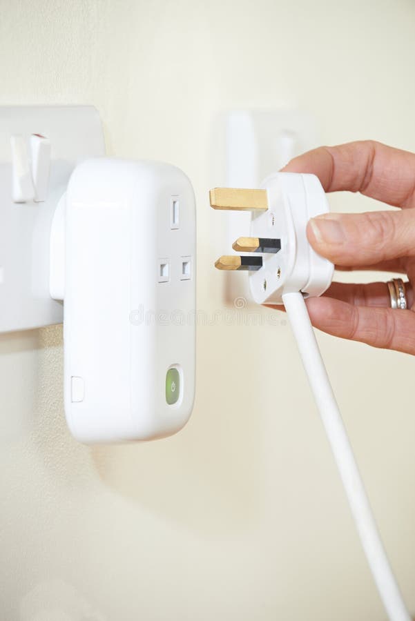Woman Putting Plug into Smart Electricity Socket Stock Photo - Image of ...