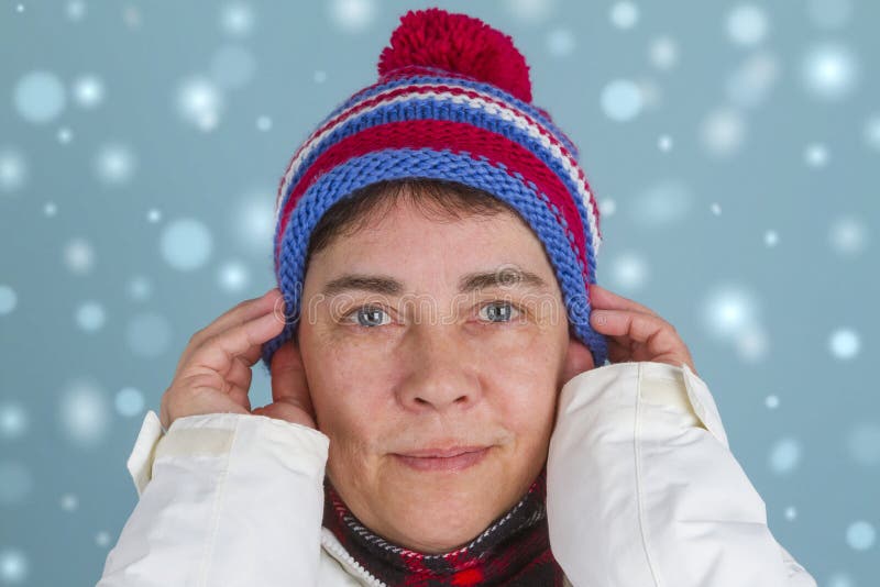 Woman is Putting on Winter Cap Stock Image - Image of model, clothes ...