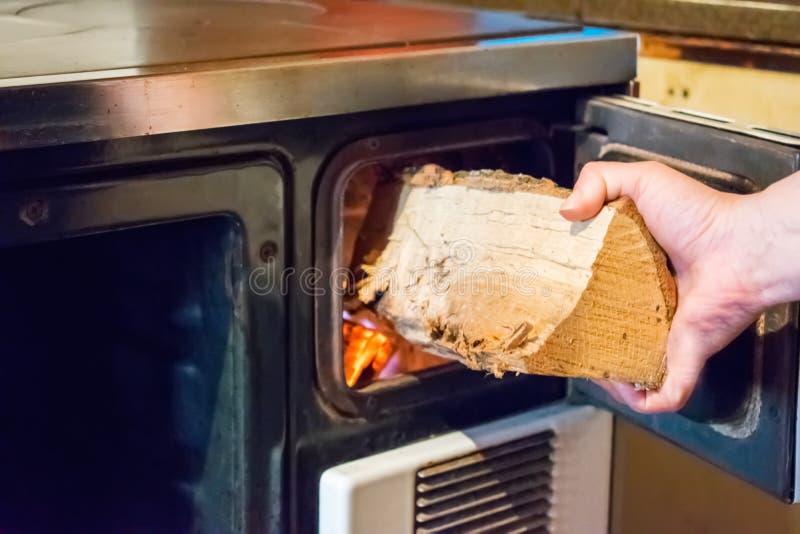 Woman Putting Wood into the Fire Stock Photo - Image of fire, material ...