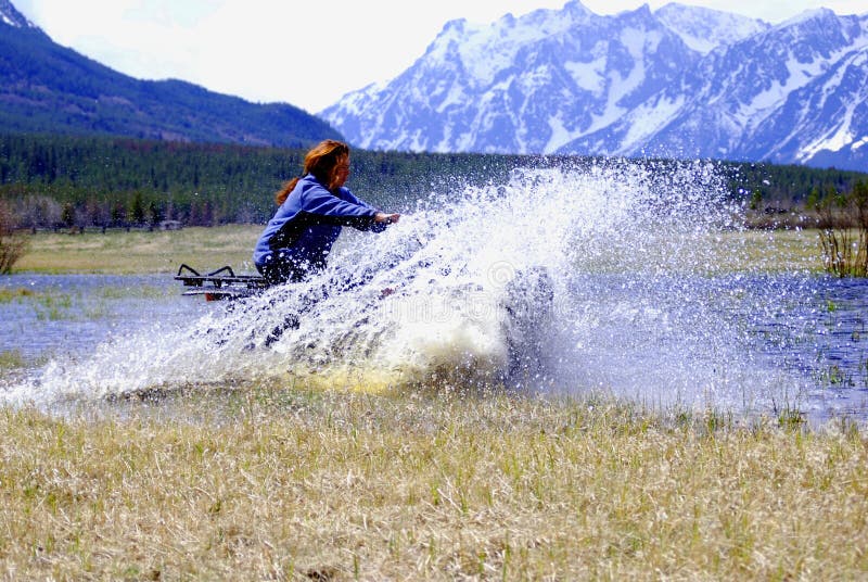 Woman riding ATV stock photo. Image of driving, power - 5604980