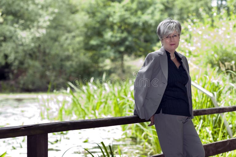 Woman at railing stock image. Image of lean, stand, reeds - 20003727