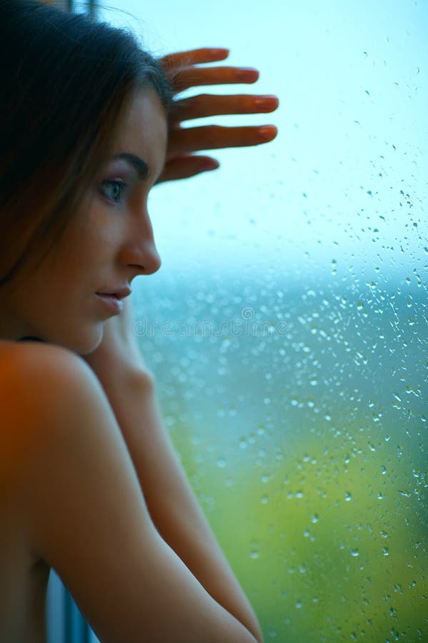 Woman and rainy window stock photo. Image of woman, face - 10536806