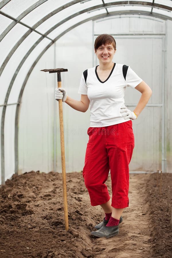 Woman with Rake in Hothouse Stock Image - Image of farm, girl: 20649905