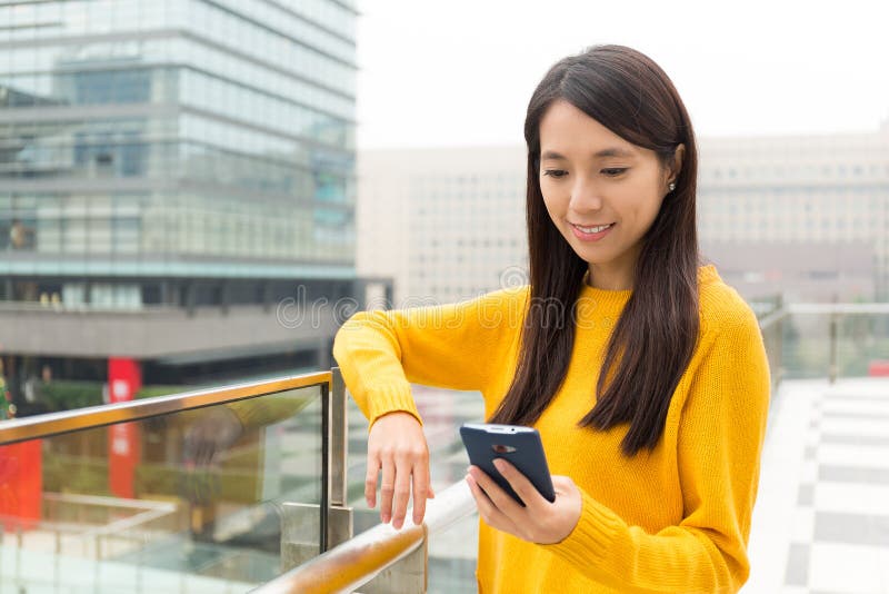 Woman read on the phone stock image. Image of sitting - 64868343