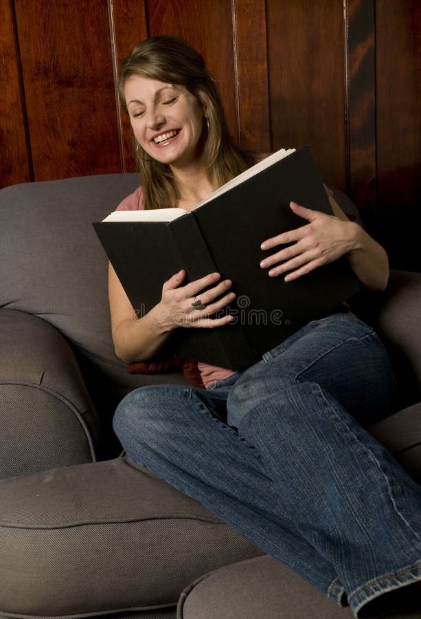 A woman reading a big book stock photo. Image of hands - 7743778