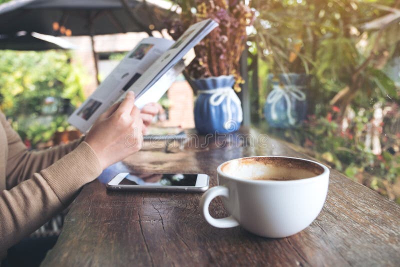 A Woman Reading Book and Drinking Coffee in Cafe Stock Image - Image of ...