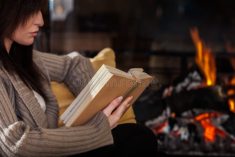 Woman Reading a Book by Fireplace Stock Image - Image of beautiful ...