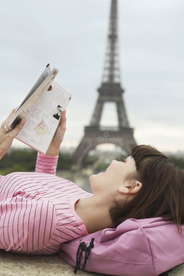 Woman Reading Book in Front of Eiffel Tower Editorial Stock Image ...