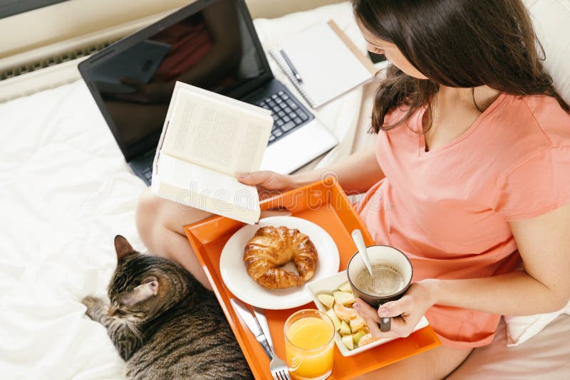 Woman Reading the Book and Having Breakfast. Stock Photo - Image of ...