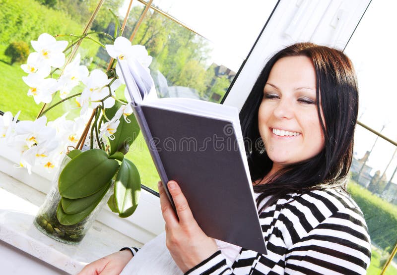 Woman Reading Book in House Stock Image - Image of female, adult: 19169653