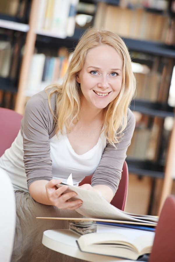 Woman Reading Book in Library Stock Photo - Image of girl, pupil: 33233274