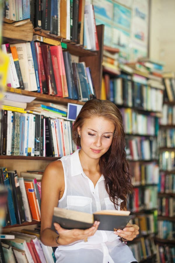 Woman Reading a Book in Library Stock Image - Image of emotion, hiding ...
