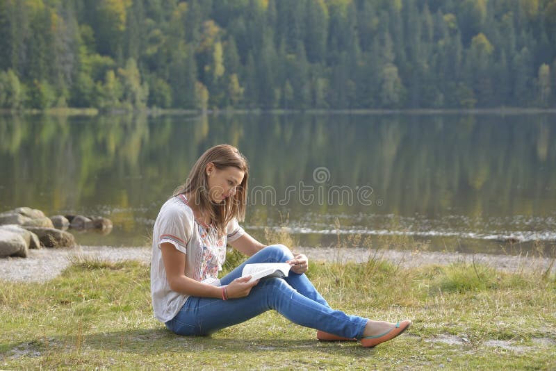 Woman Reading a Book Outdoor Stock Photo - Image of people, activity ...