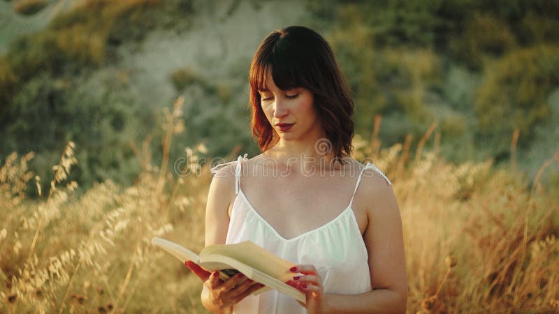 Woman Reading a Book Outdoor at Sunset. Stock Image - Image of ebook ...