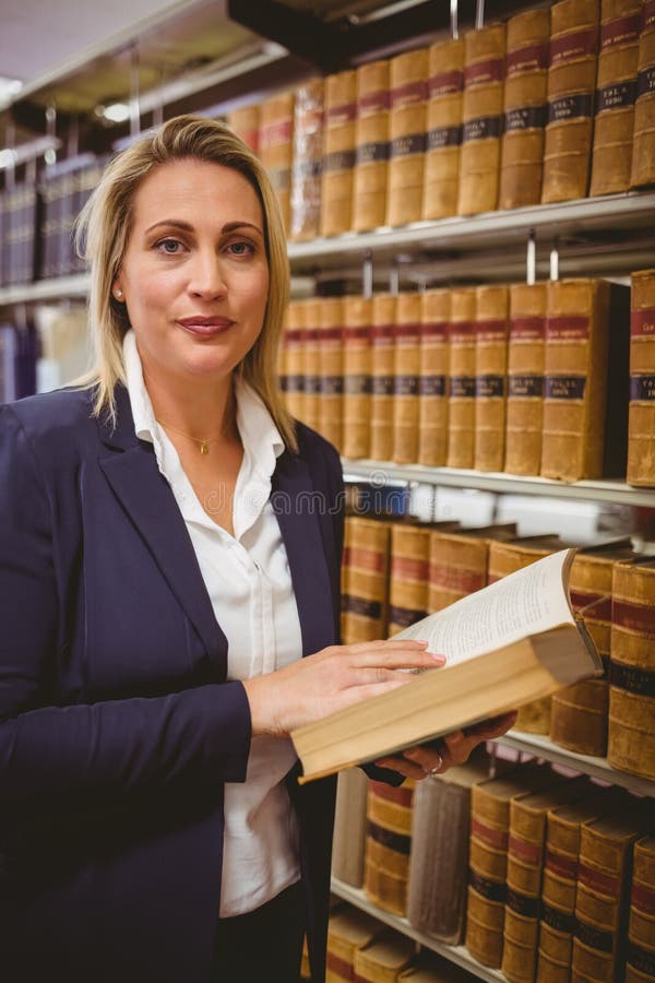 Woman Reading a Book from Shelf Standing Stock Photo - Image of library ...