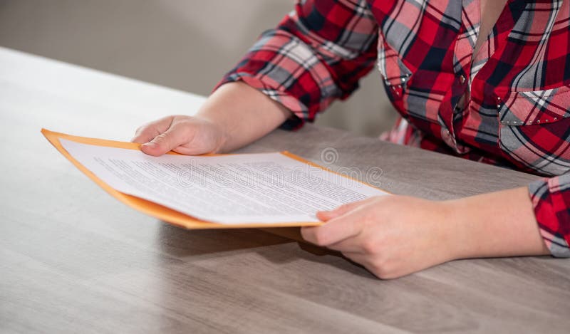 Woman checking a document stock image. Image of work - 198058663
