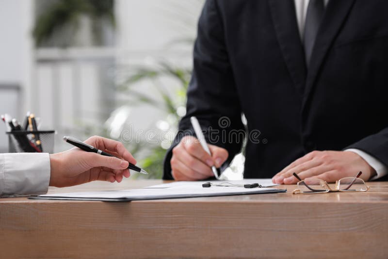Woman Reading Document at Table in Office, Closeup. Signing Contract ...