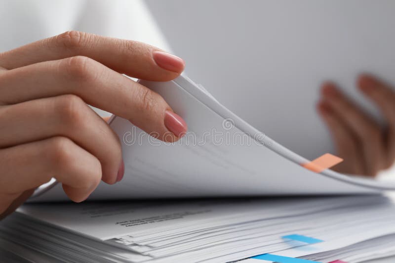 Woman Reading Documents at Table in Office, Closeup Stock Photo - Image ...