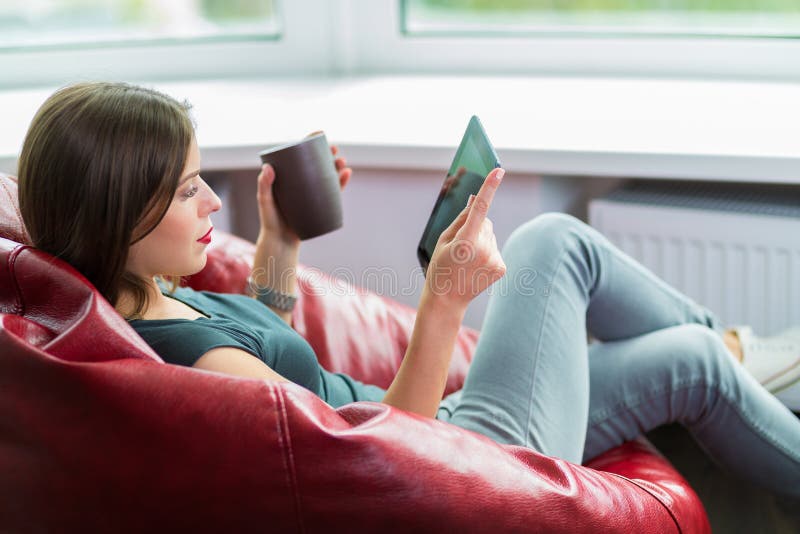 Woman reading an ebook stock photo. Image of woman, relaxing - 71015496