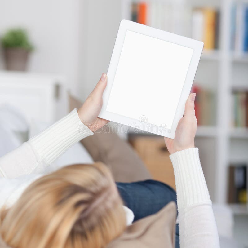 Woman Reading on Ebook while Lying on Sofa Stock Image - Image of ...