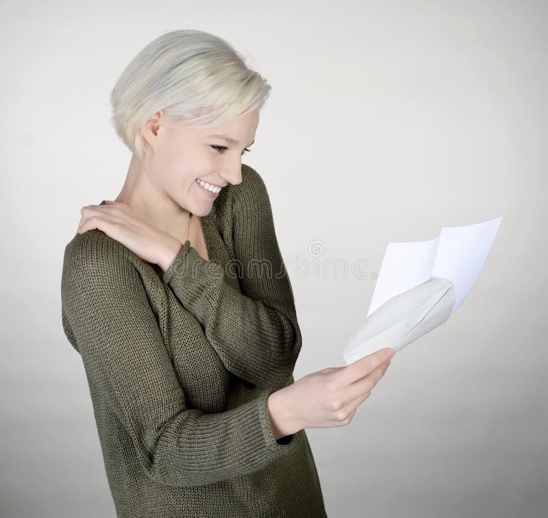 Woman reading letter stock photo. Image of answer, blond - 76483396
