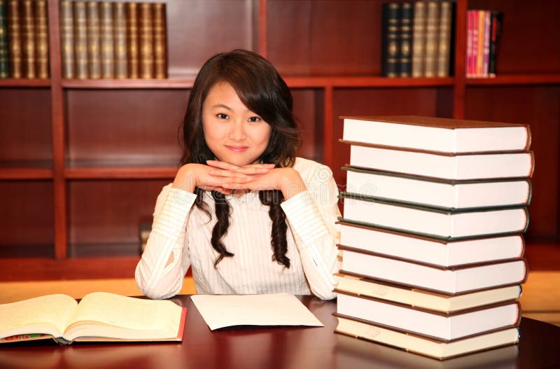 Woman reading in library stock image. Image of people - 7568287