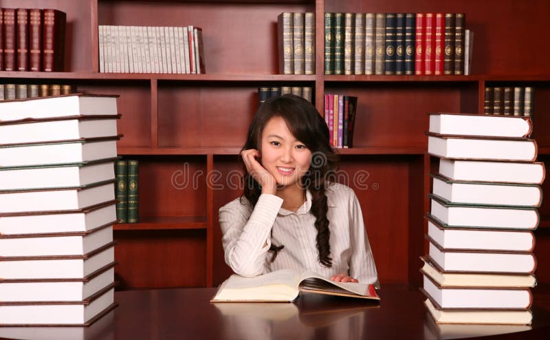 Woman reading in library stock image. Image of publishing - 7568331