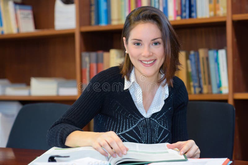 Woman reading in library stock image. Image of pose, develop - 88082379