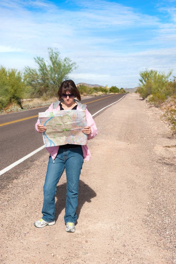 Woman reading map stock image. Image of confusion, printed - 17842875