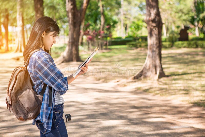 Woman reading a map stock image. Image of reading, looking - 83278379