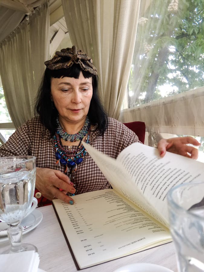 Woman reading menu. stock image. Image of lady, senior - 71189751