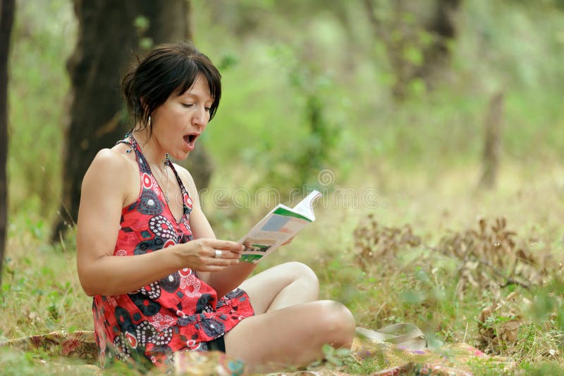 Woman reading in nature stock photo. Image of enjoyment - 26326418