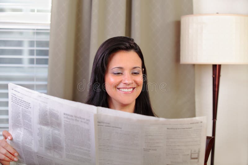Woman reading newspaper stock photo. Image of modern - 18356092