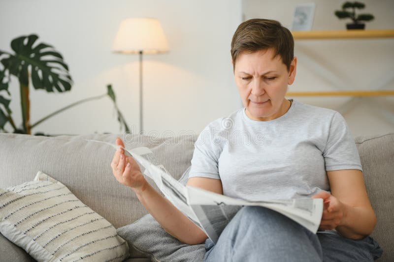 Woman Reading Newspaper at Home Stock Image - Image of paper, newspaper ...