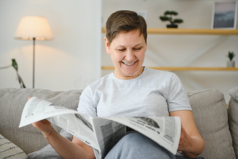 Woman Reading Newspaper at Home Stock Image - Image of paper, home ...