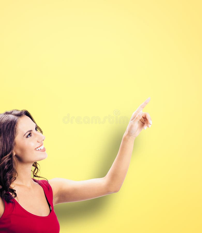 Woman Reading and Pointing Up at Copy Space, Visual Imaginary or ...