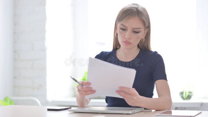 Woman Reading Reports while Sitting in Office Stock Photo - Image of ...