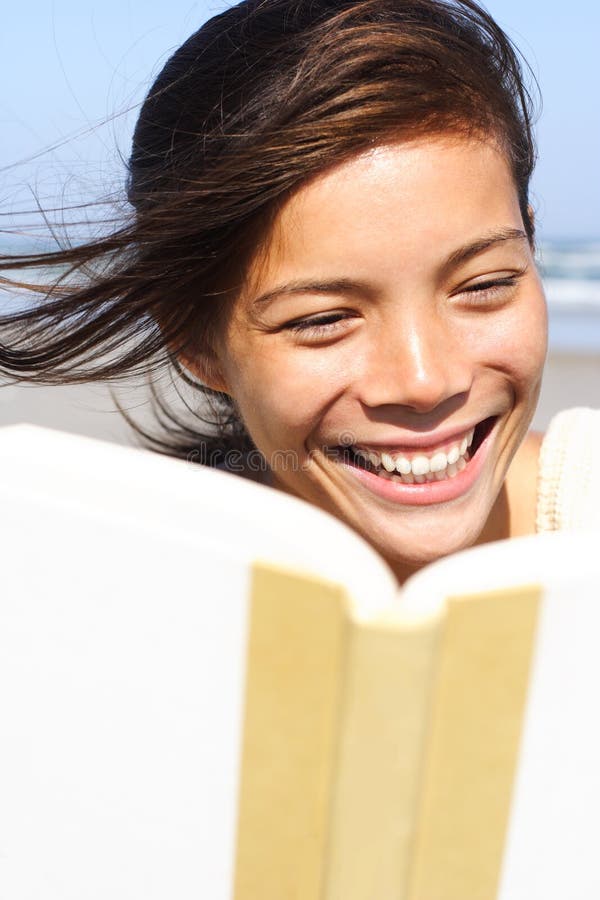 Woman reading smiling stock image. Image of asian, novel - 10631365