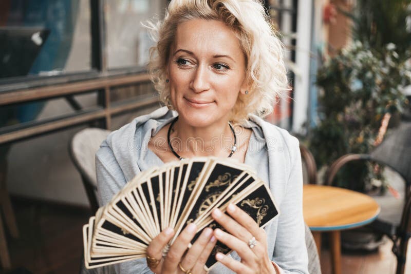 Woman is Reading Tarot Cards in Cafe Stock Photo - Image of deck ...