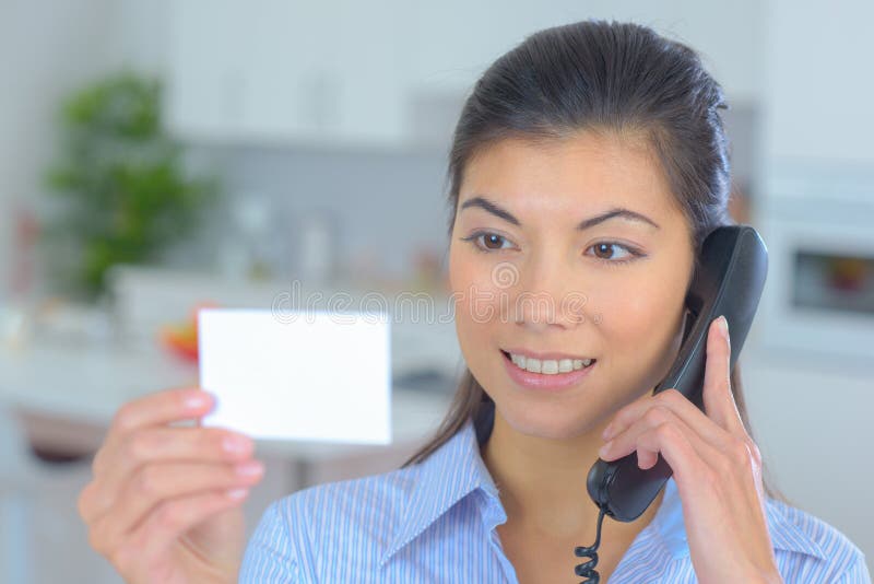 Woman Reading Telephone Number from Business Card Stock Image - Image ...