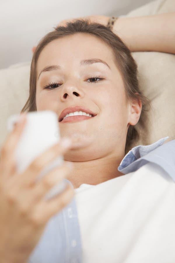 Woman Reading Text Message on a Mobile Phone Stock Image - Image of ...