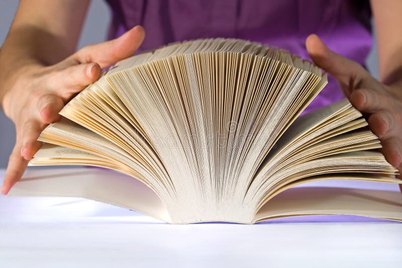 Woman reading a thick book stock image. Image of page - 13214693