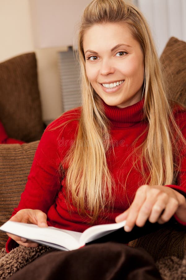 Woman reading stock photo. Image of happiness, couch - 33894146