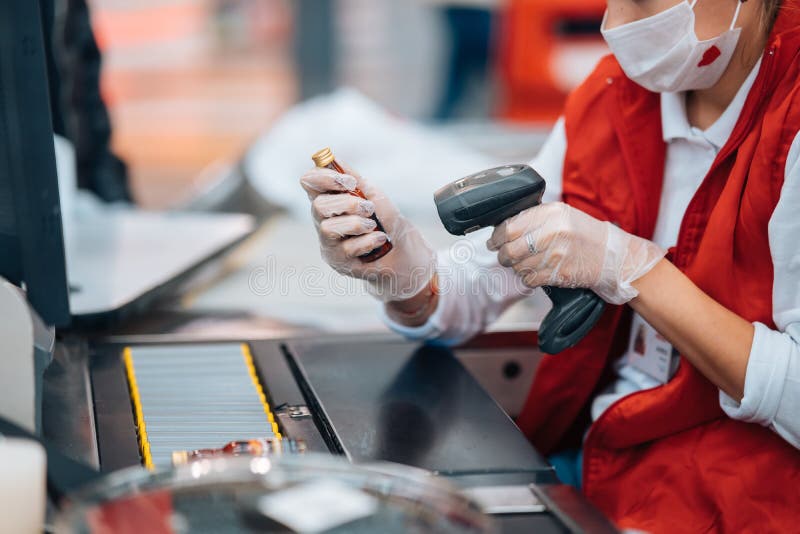 A Woman Reads the Barcode at Checkout Machine in Supermarket Stock ...