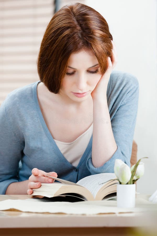 Woman Reads the Book at the Shop Stock Photo - Image of beautiful, face ...