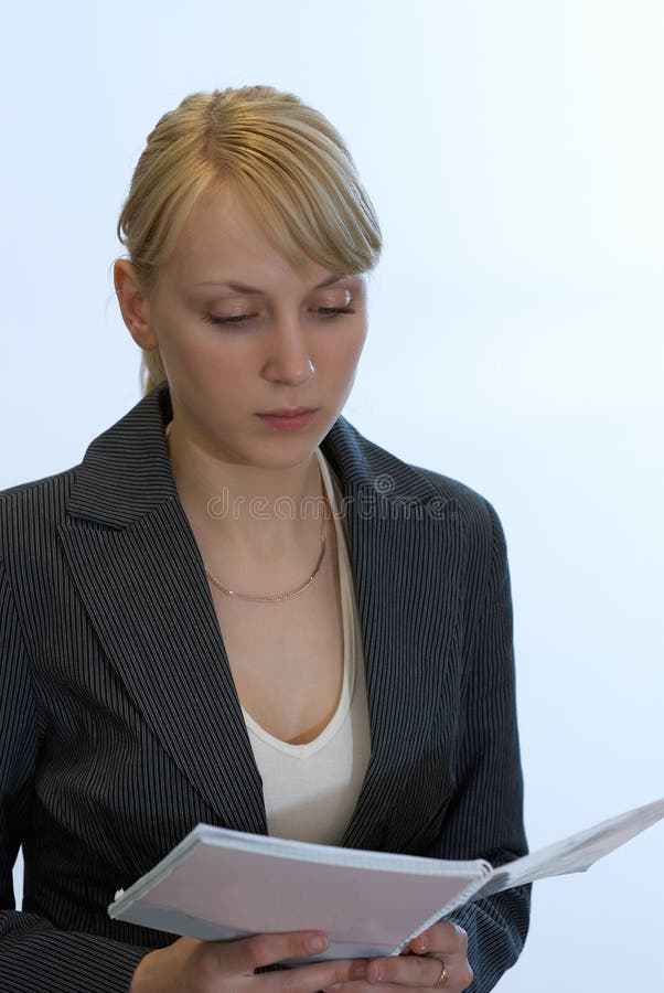 Woman reads a writing-book stock photo. Image of occupation - 5602336