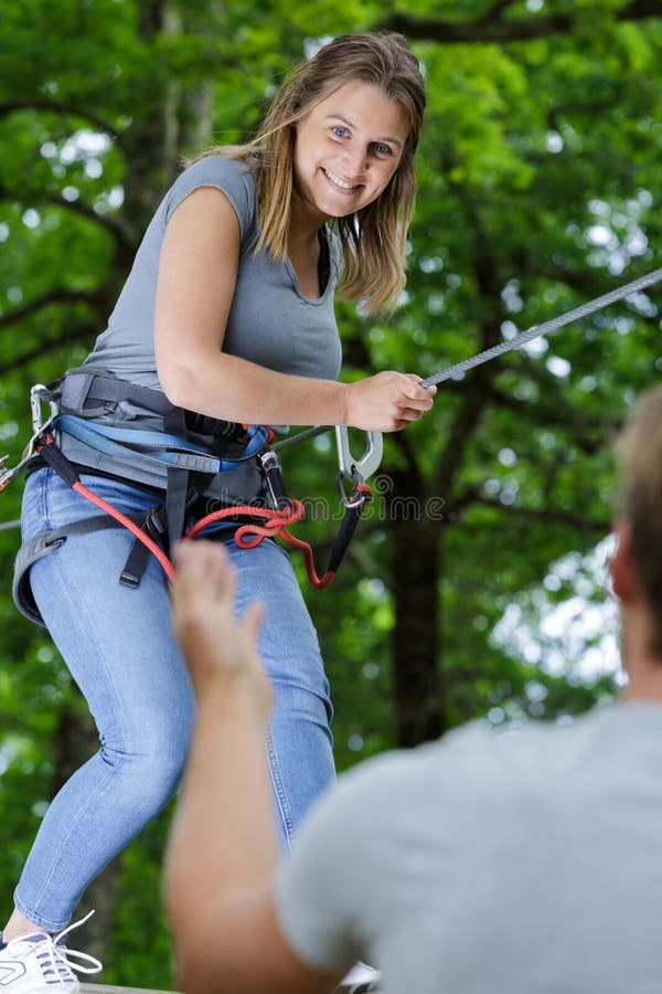 Woman ready to do zipline stock image. Image of hook - 292369213